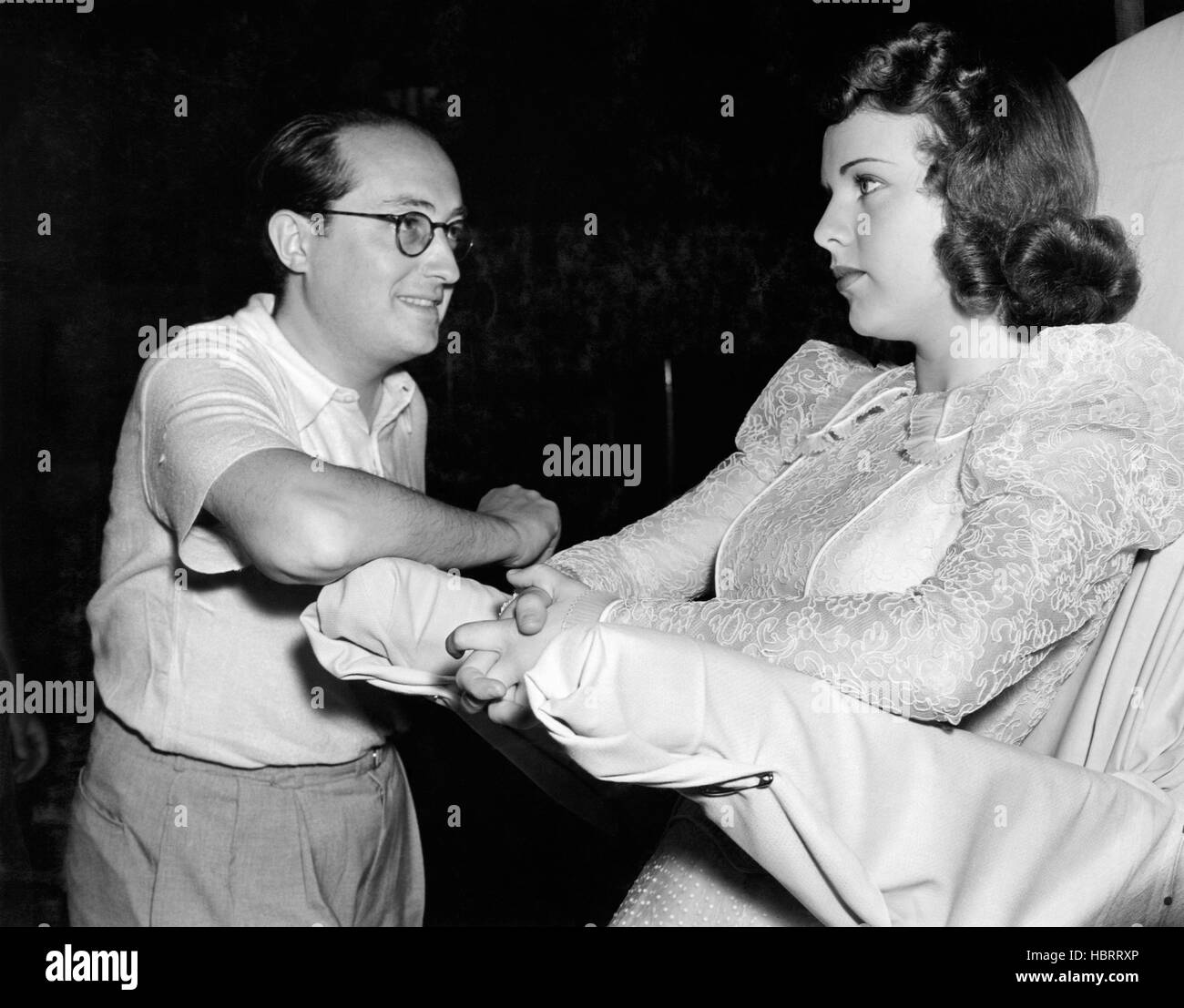 FIRST LOVE, from left: director Henry Koster, Deanna durbin on set ...