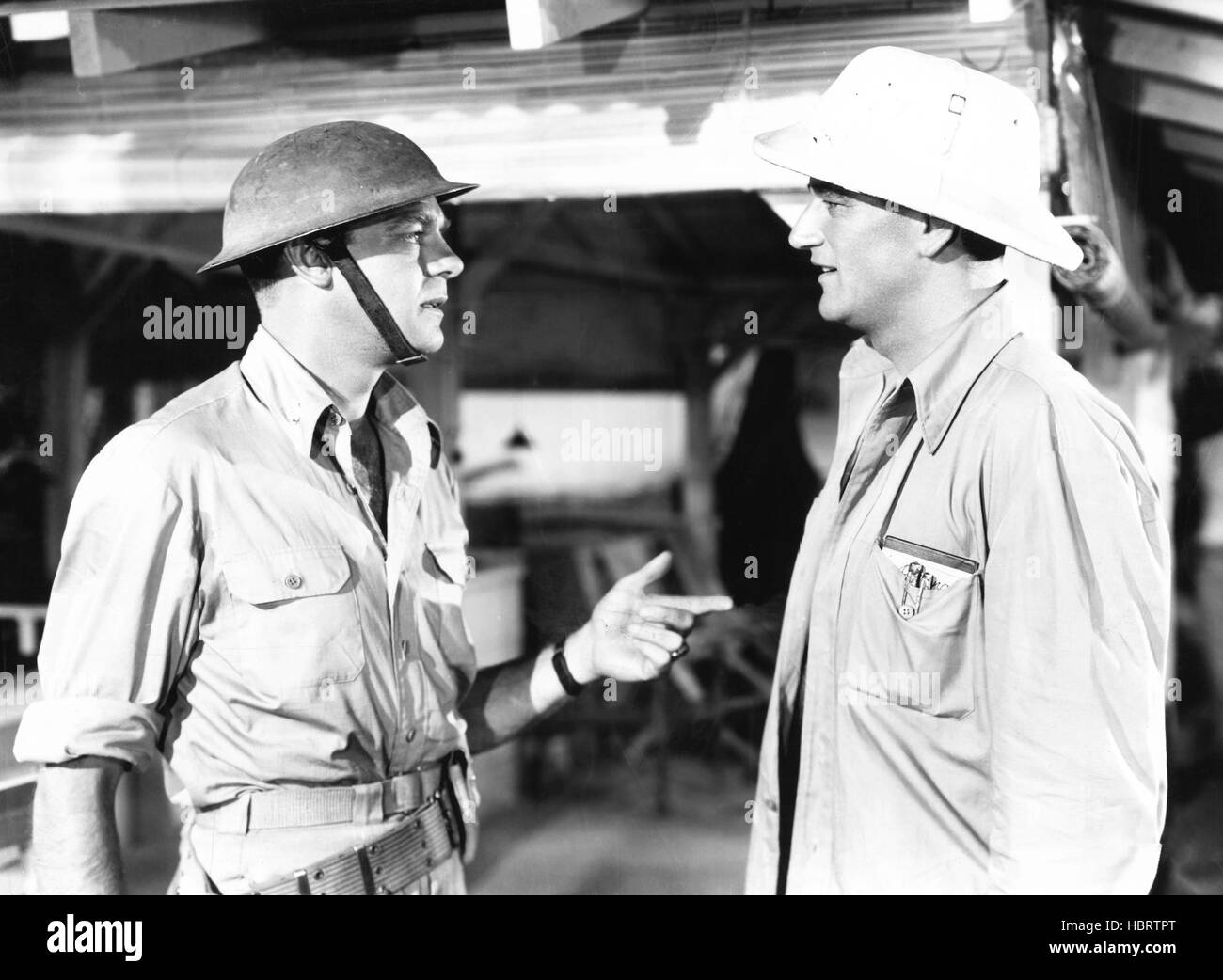 THE FIGHTING SEABEES, from left: Dennis O'Keefe, John Wayne, 1944 Stock ...