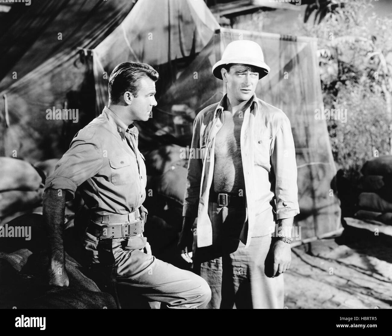 THE FIGHTING SEABEES, from left, Dennis O'Keefe, John Wayne, 1944 Stock ...