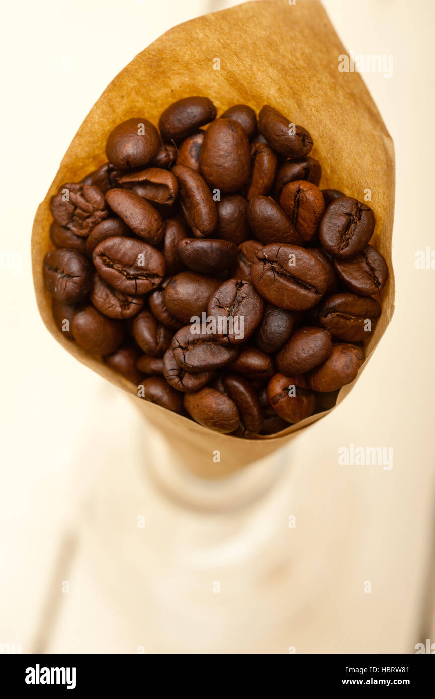 espresso coffee beans on a paper cone Stock Photo - Alamy