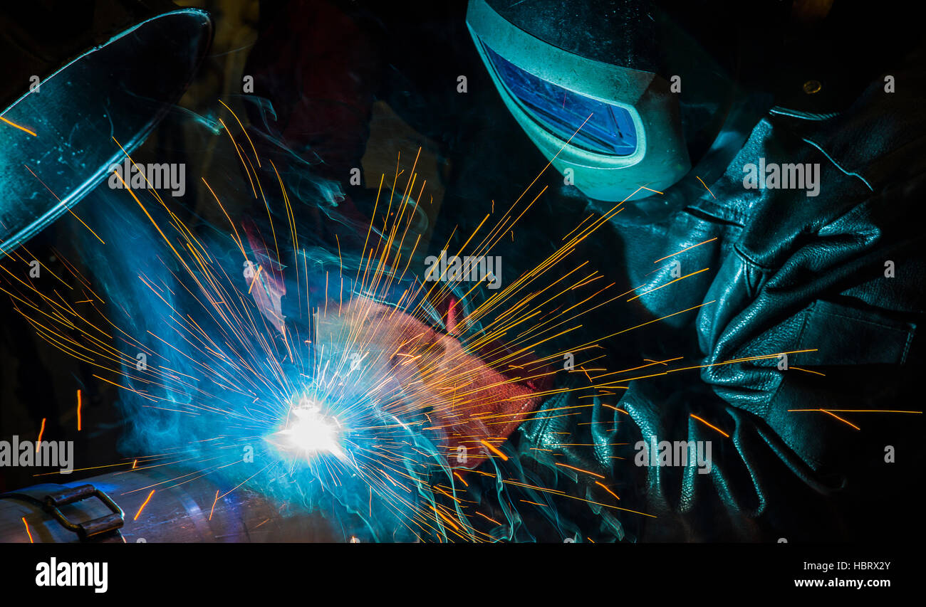 welder, craftsman, erecting technical steel Industrial steel welder in ...