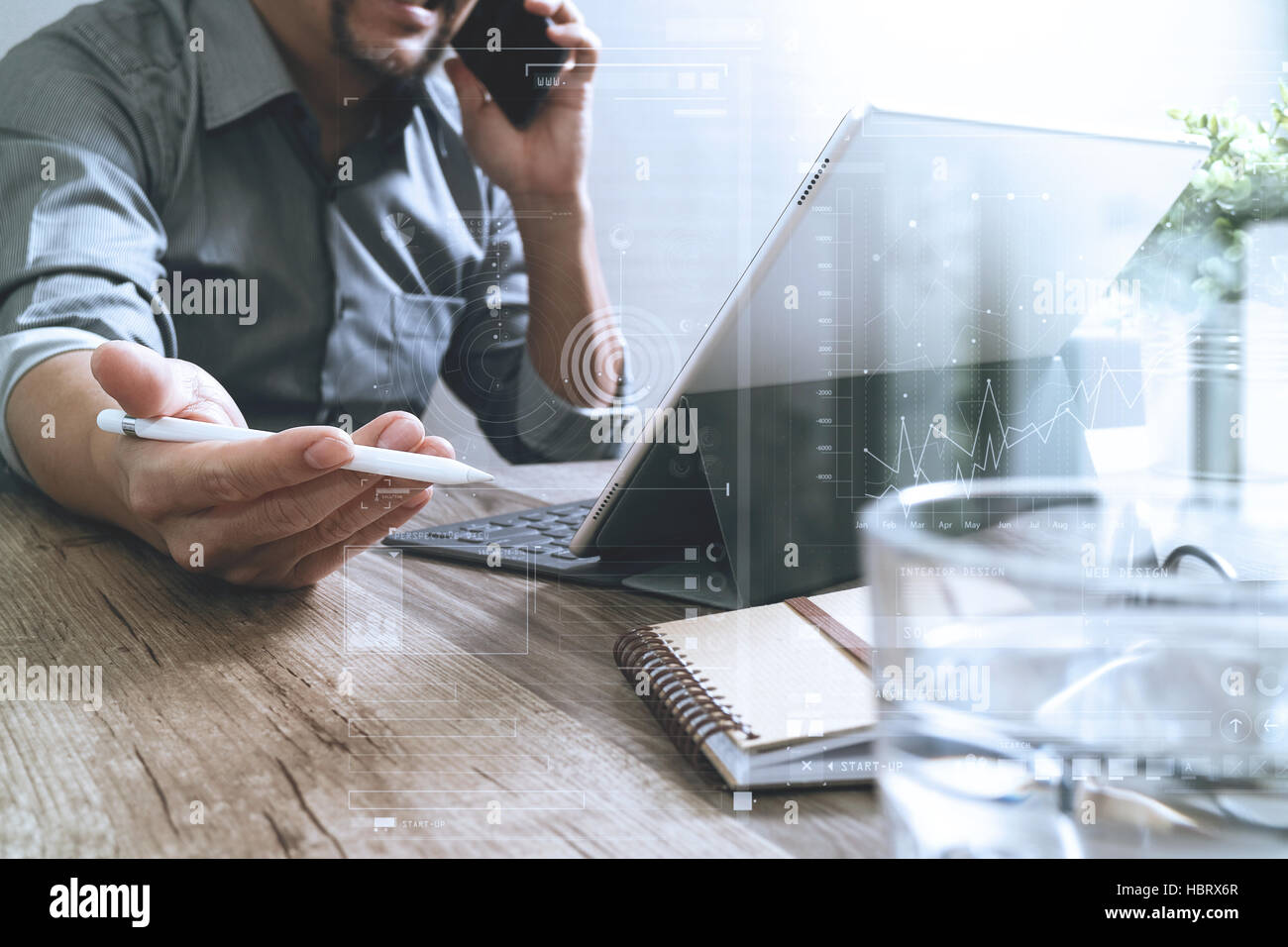 success businessman hand using smart phone,stylus pen,digital tablet docking smart keyboard on ...