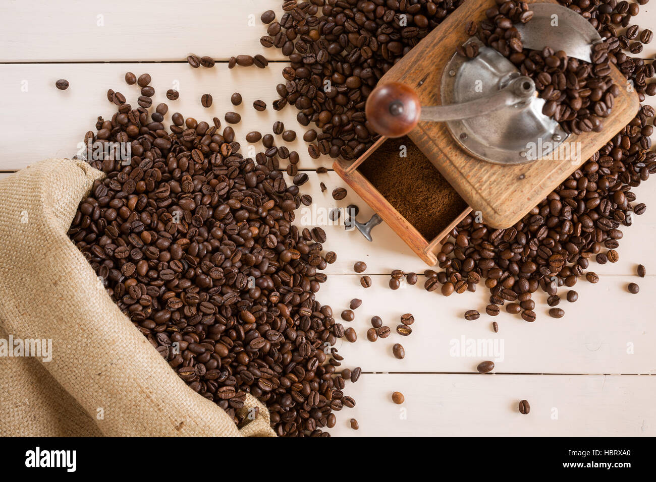 Bag of coffee and coffee grinder Stock Photo - Alamy