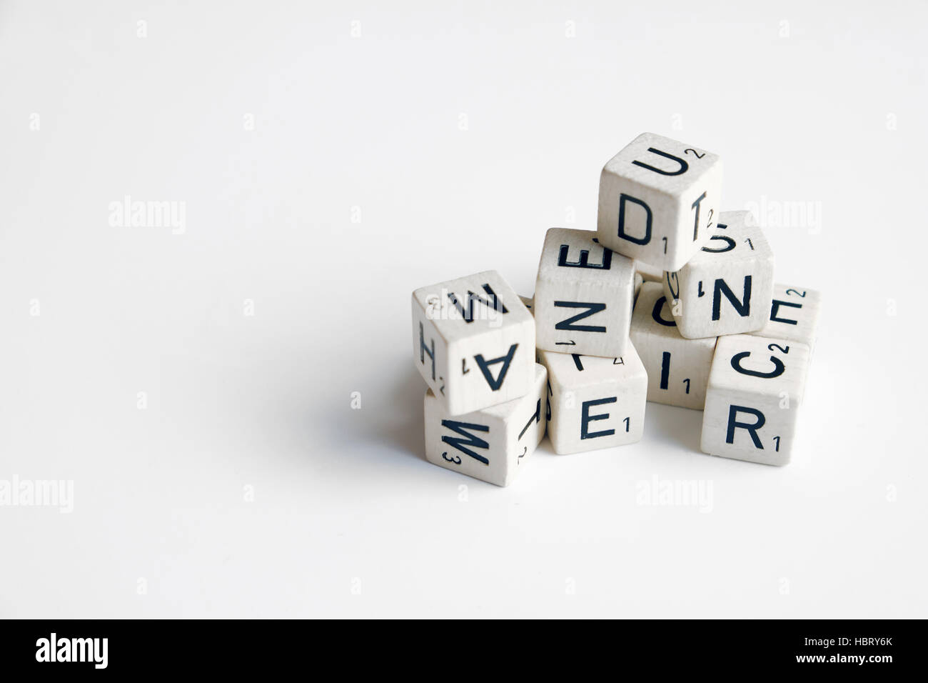 pile of cubes with letters and numbers on white Stock Photo - Alamy