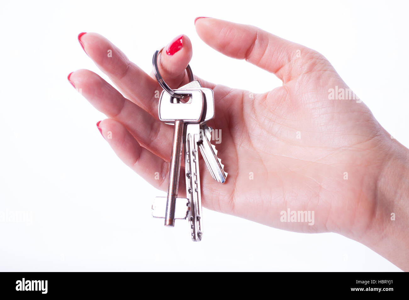 Woman hand holding keys Stock Photo - Alamy
