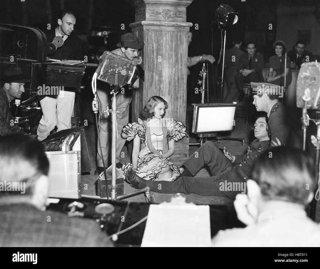 FORGED PASSPORT, John Auer, (in fedora), directing (from left) June ...