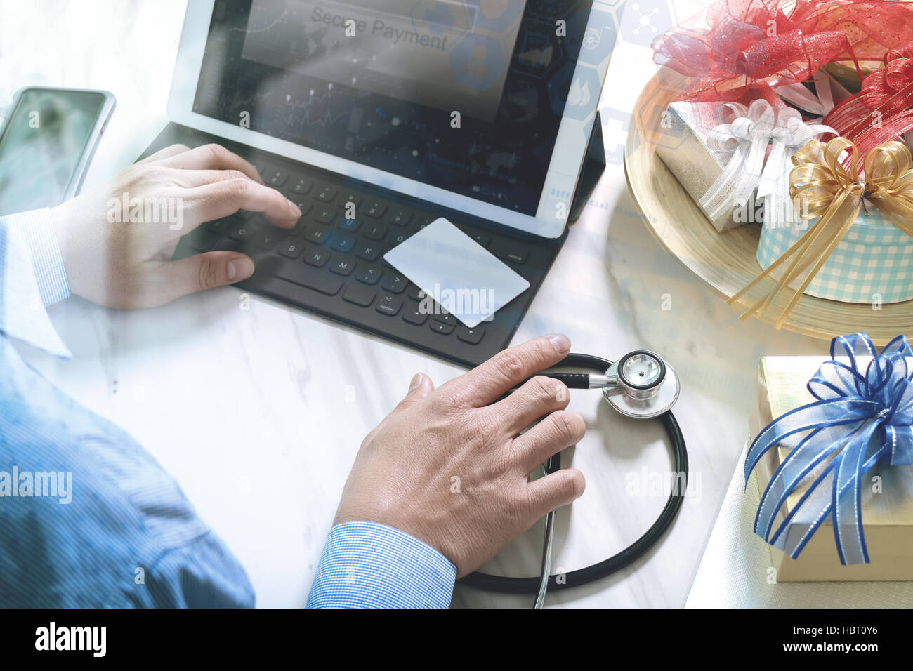 Gift giving,medical doctor Hand with credit card and hand with gift ...