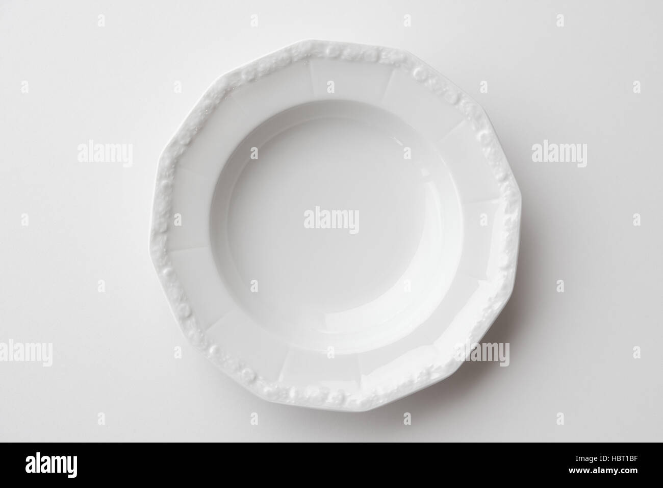 beautiful empty plate isolated on white background Stock Photo - Alamy