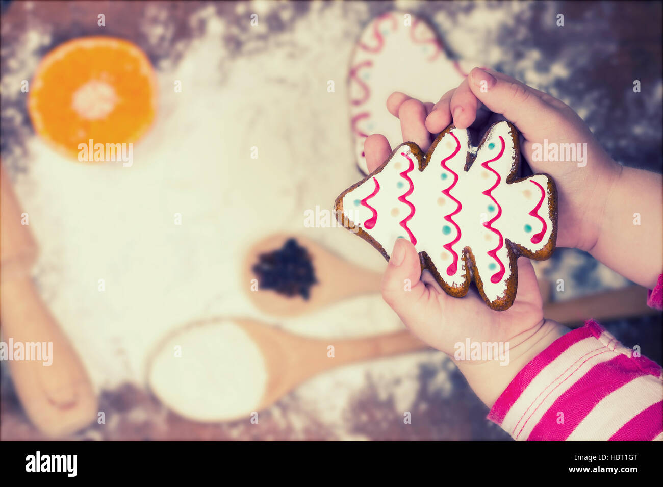 Child hands holding gingerbread cookie - Vintage Christmas background ...