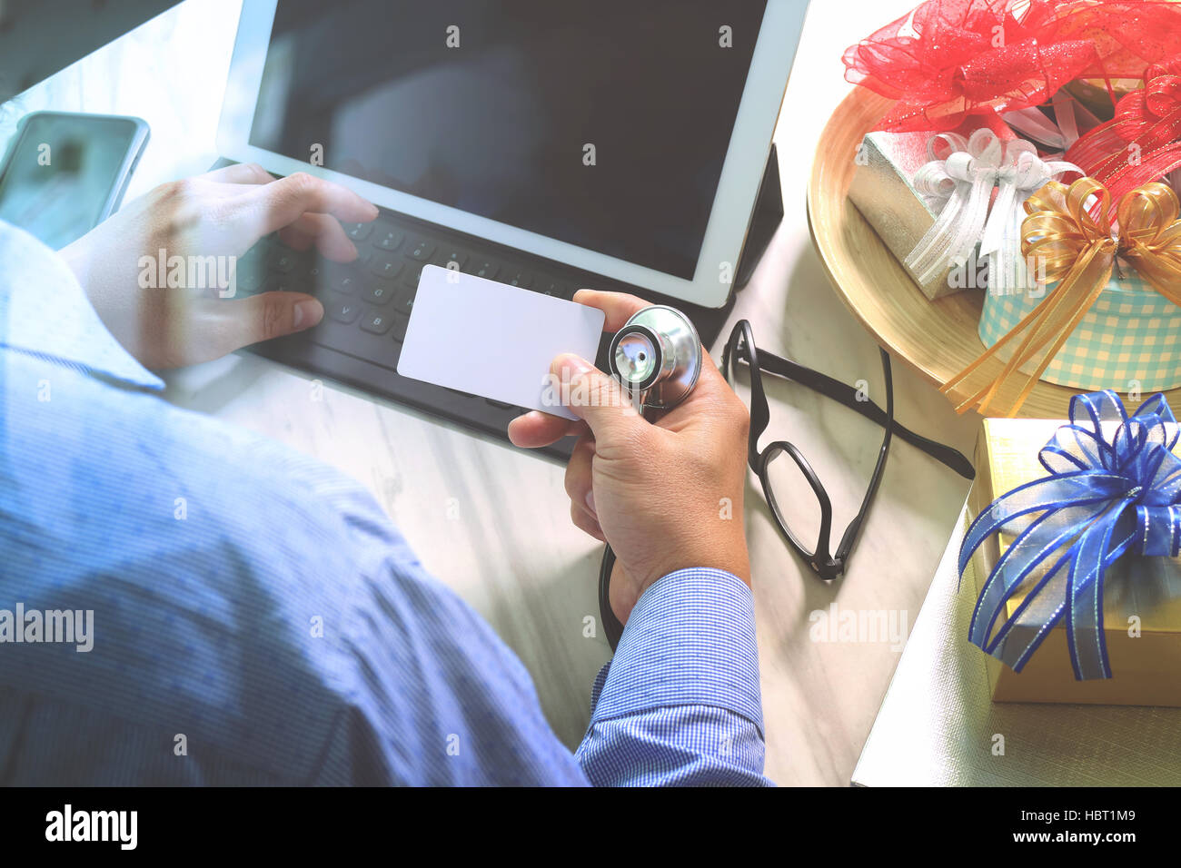 Gift giving,medical doctor Hand with credit card and hand with gift ...