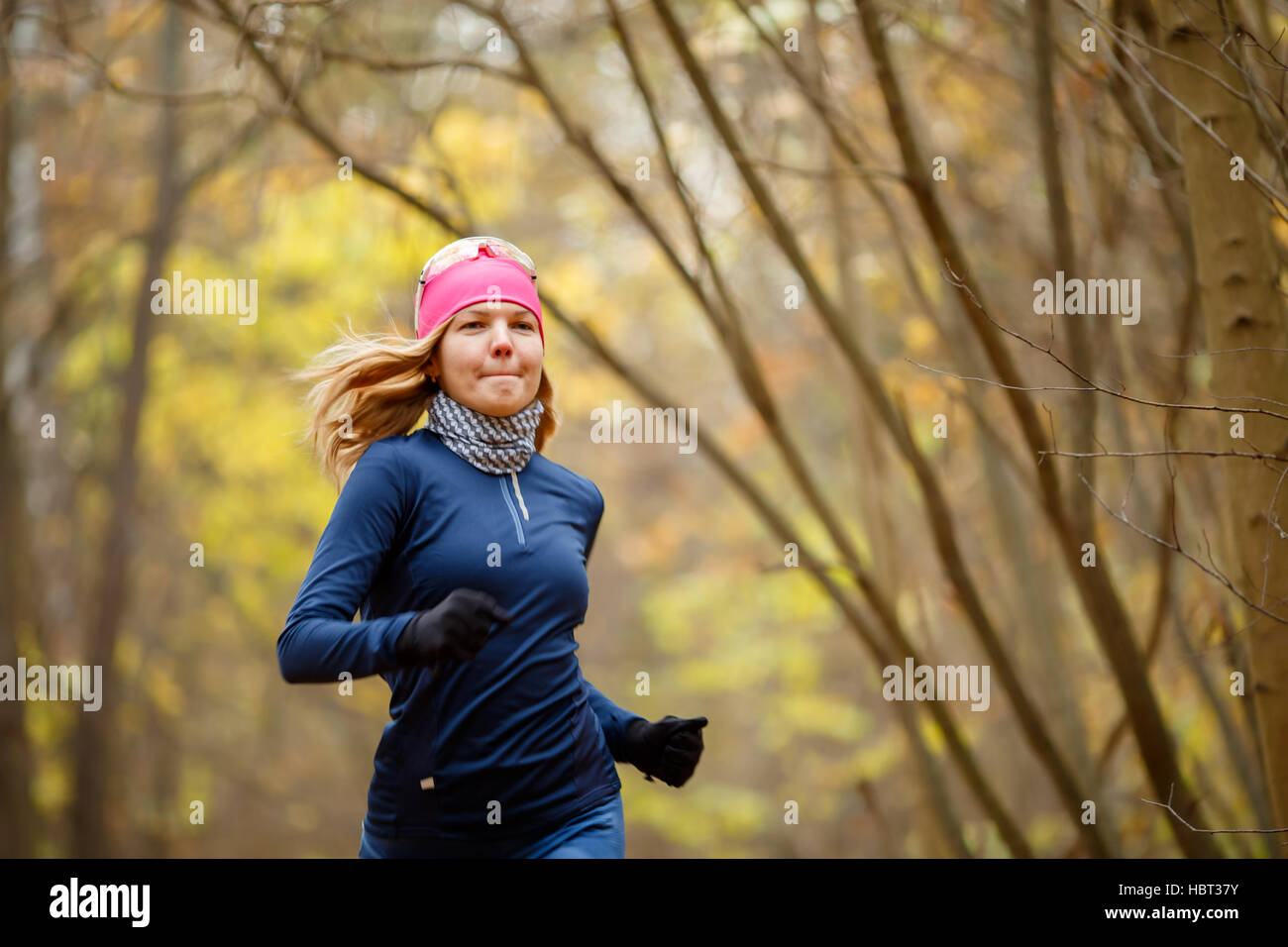 Young female running in morning Stock Photo - Alamy