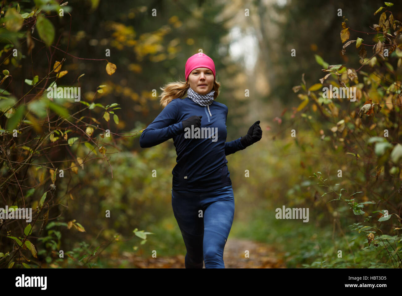 Blonde woman running in morning Stock Photo - Alamy
