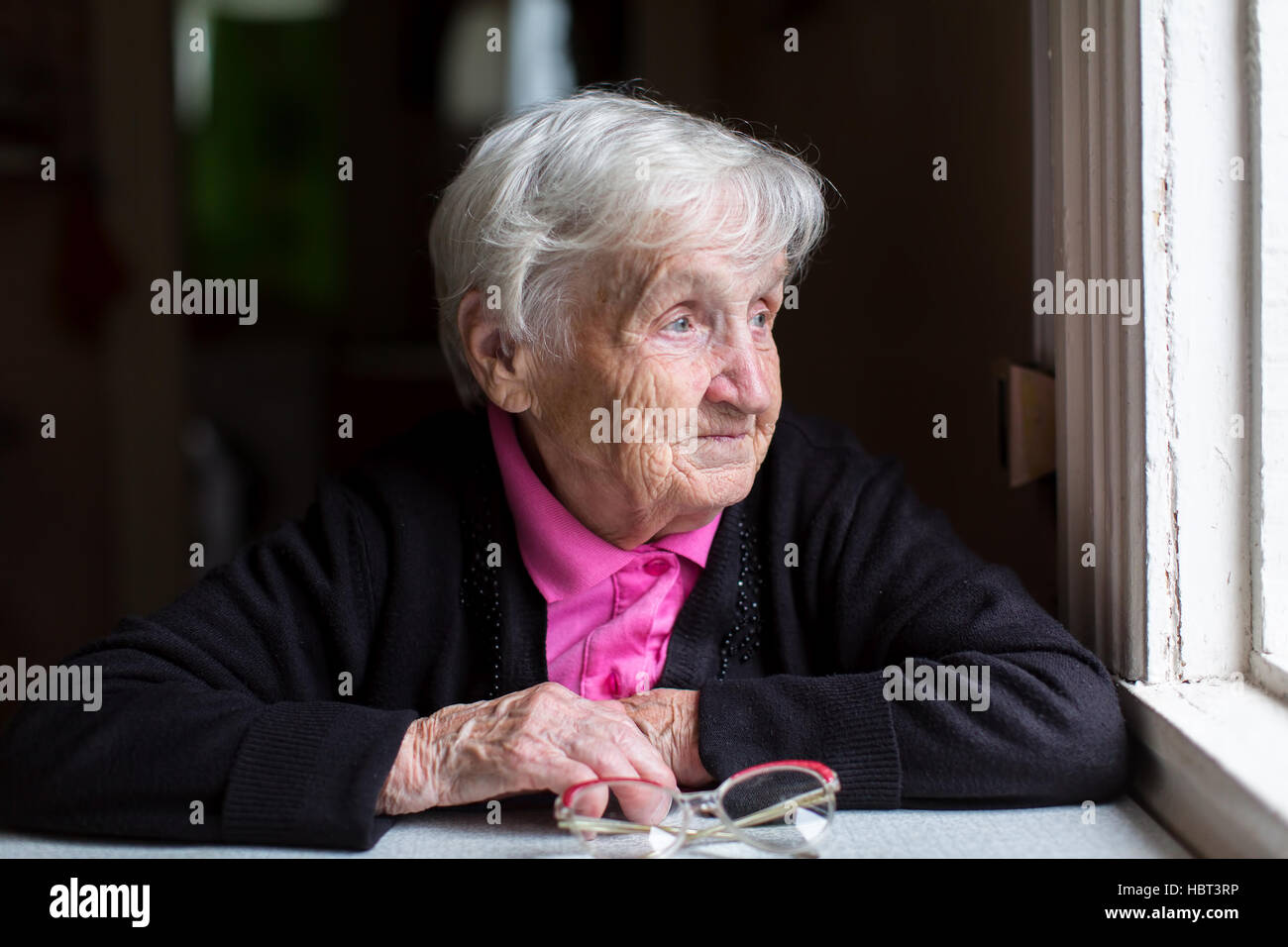 Old lady at window hi-res stock photography and images - Alamy