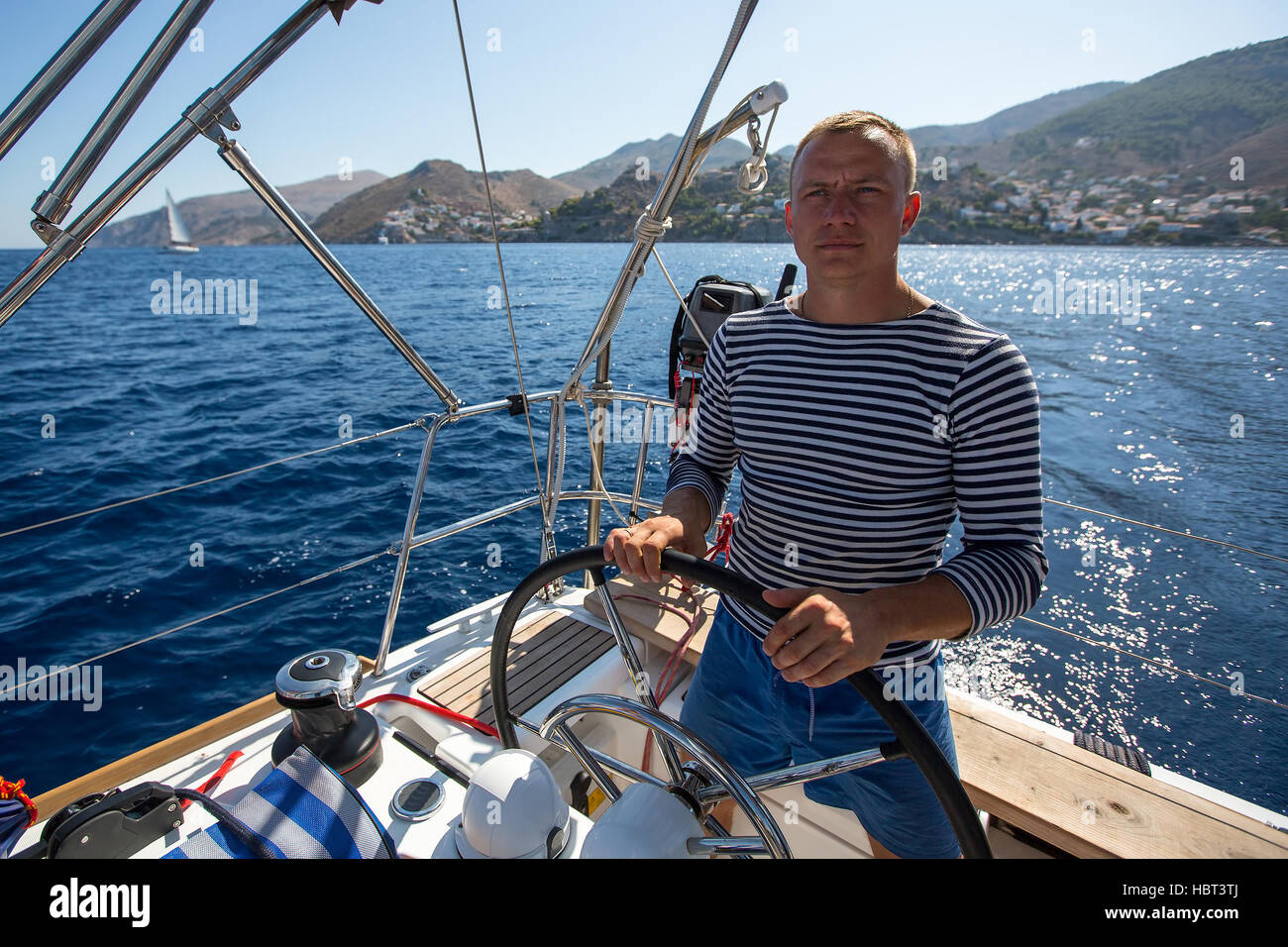 Yachtsman during in the boat race, sailing the Aegean sea Stock Photo ...