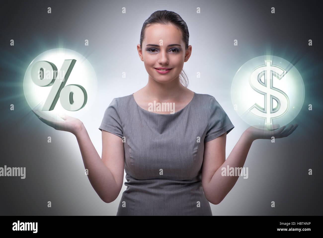 Businesswoman in high interest rates concept Stock Photo - Alamy
