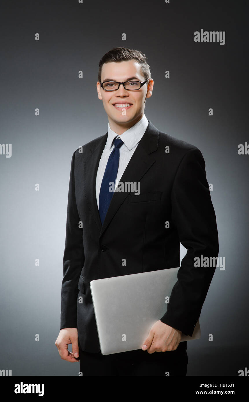 Man with laptop in business concept Stock Photo - Alamy
