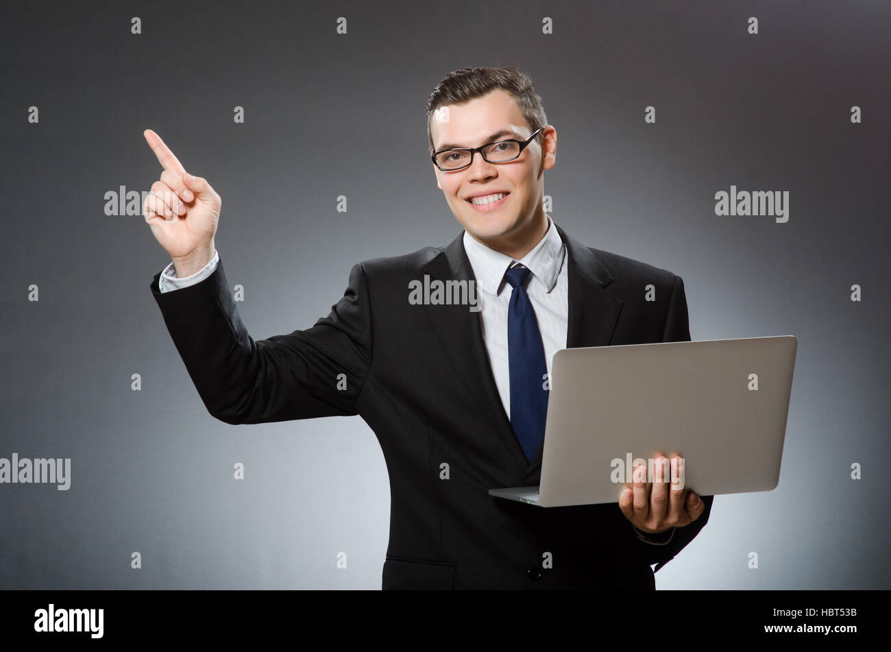 Man with laptop in business concept Stock Photo - Alamy