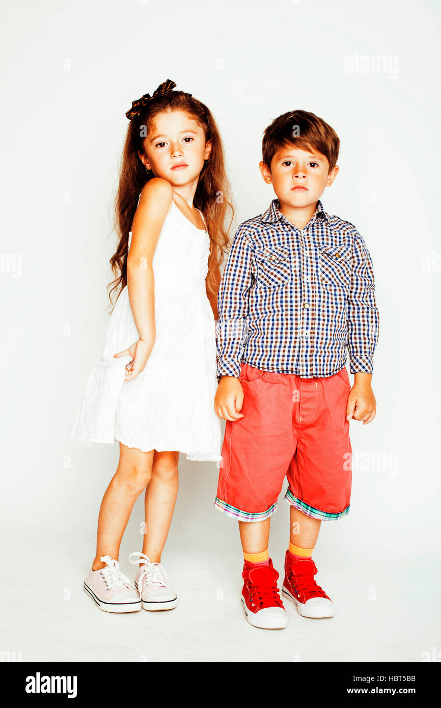 little cute boy and girl hugging playing on white background, ha Stock Photo - Alamy
