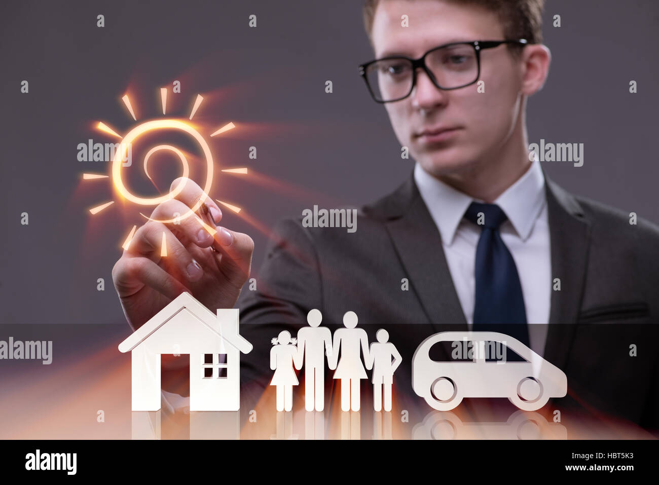 Young businessman in insurance concept Stock Photo - Alamy