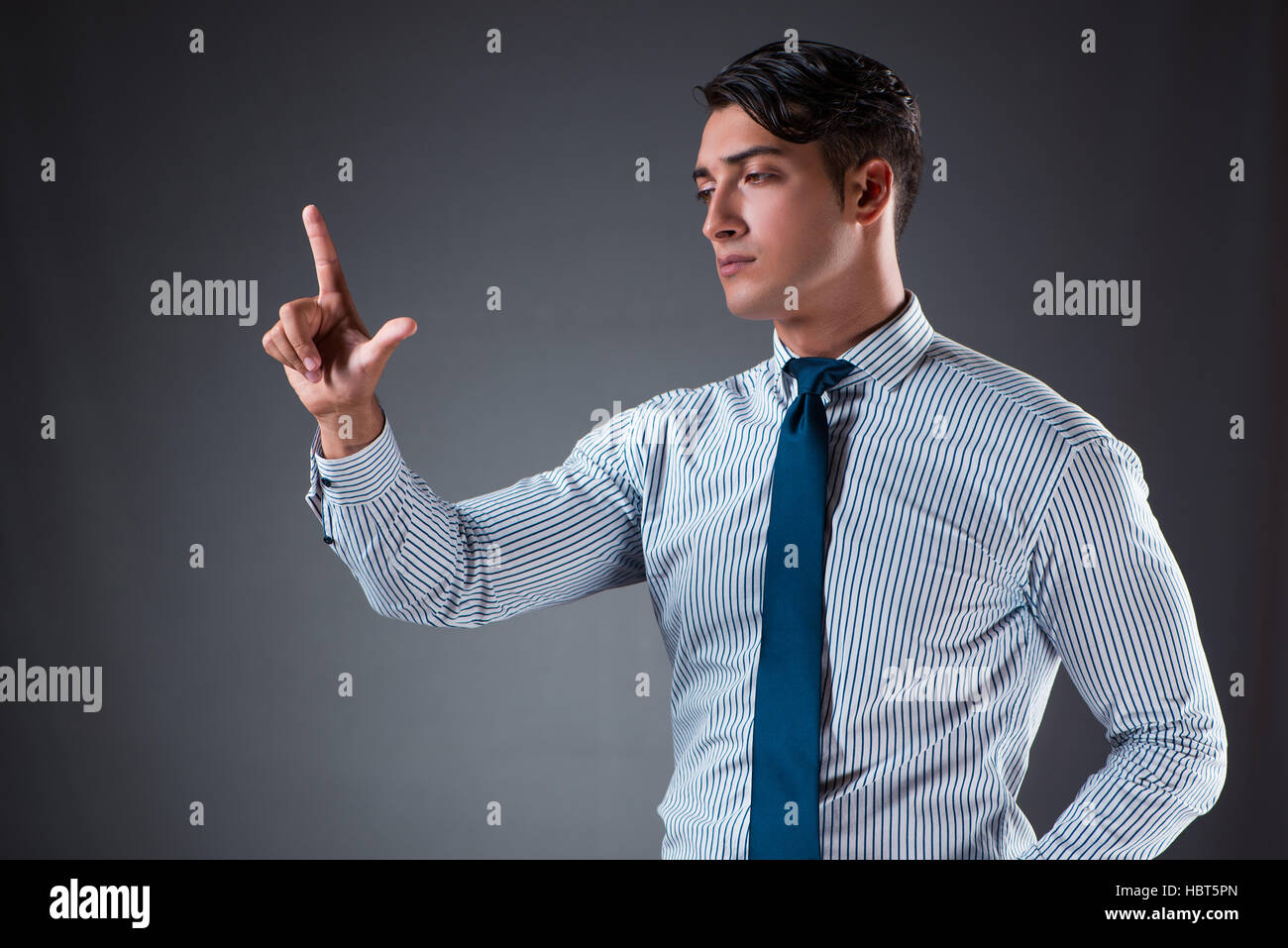 Handsome businessman pressing virtual buttons Stock Photo - Alamy