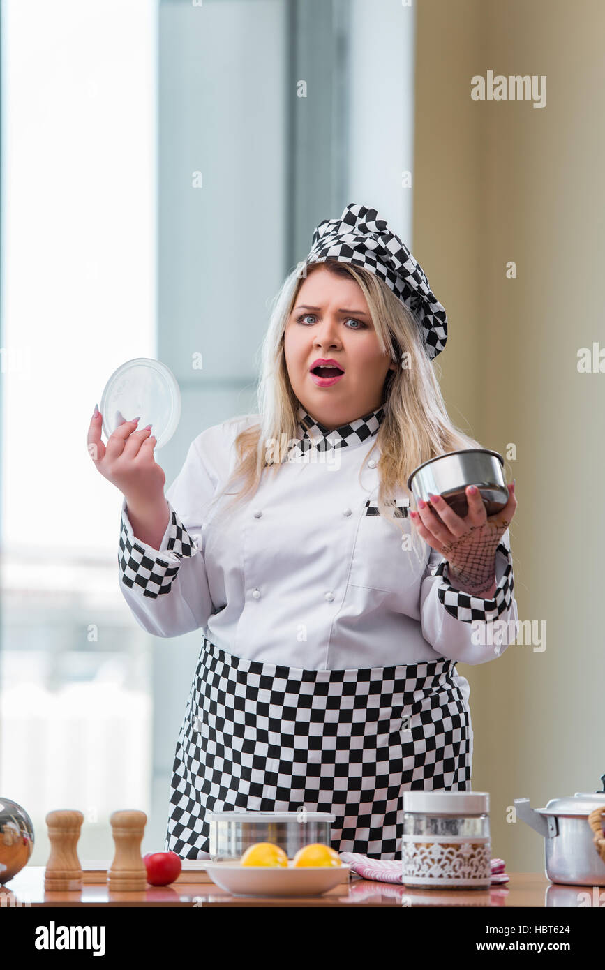 Woman cook working in the bright kitchen Stock Photo - Alamy