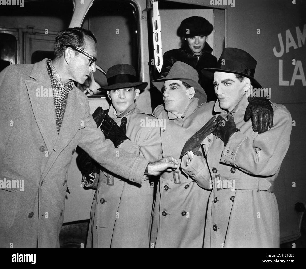 GIRLS ON THE LOOSE, director Paul Henreid on set with masked robbery ...