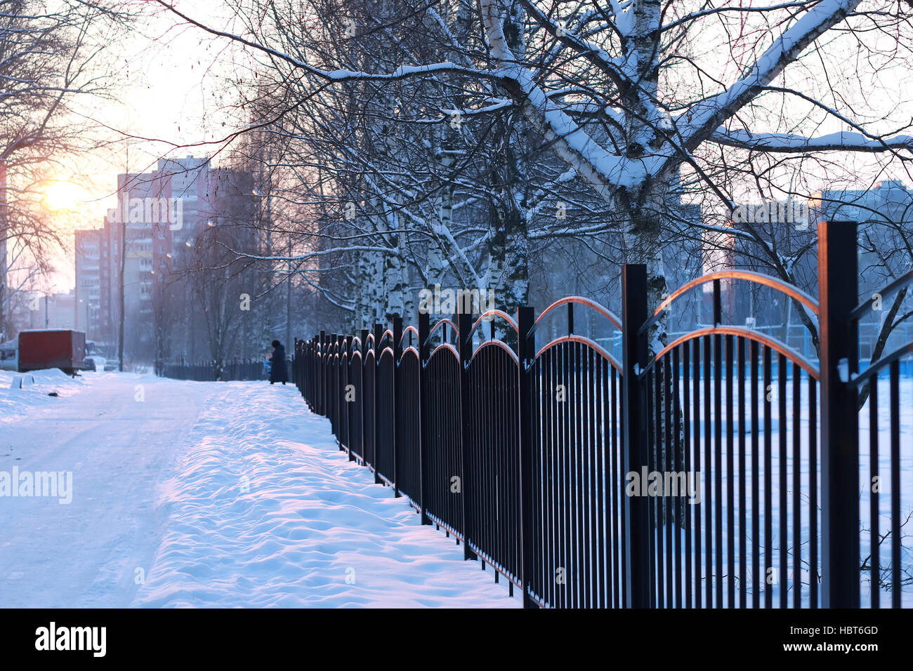 winter landscape iron fence at sunset Stock Photo - Alamy