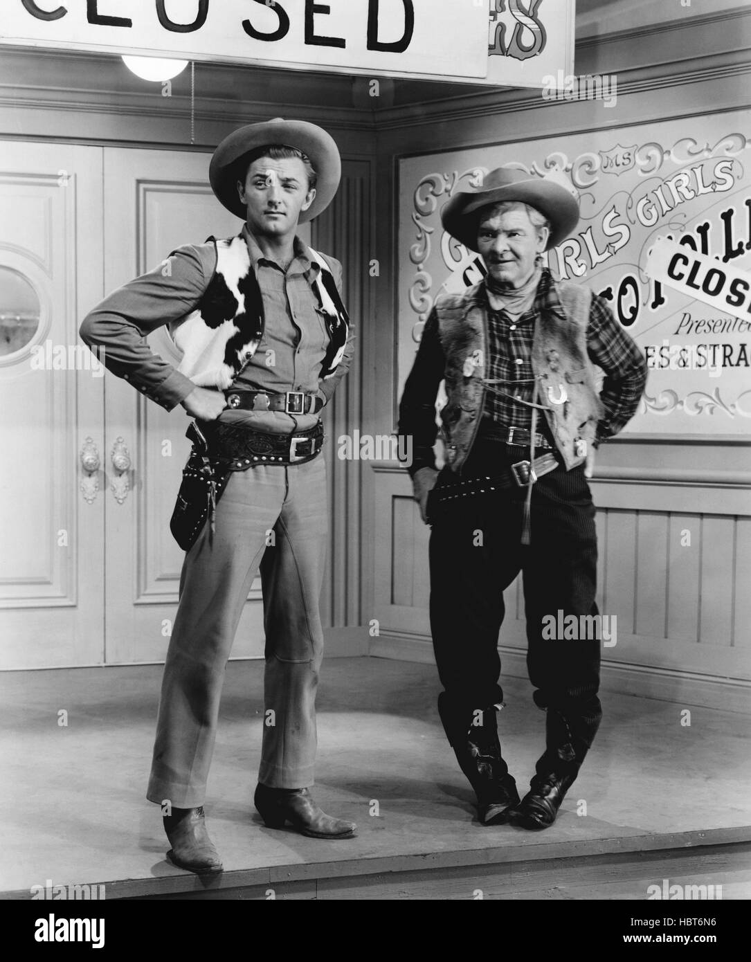 GIRL RUSH, from left: Robert Mitchum, Paul Hurst, 1944 Stock Photo - Alamy