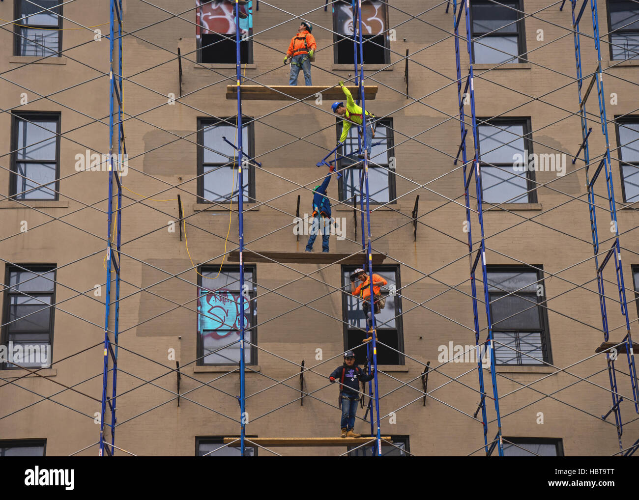 Workers on Scaffolds Stock Photo - Alamy