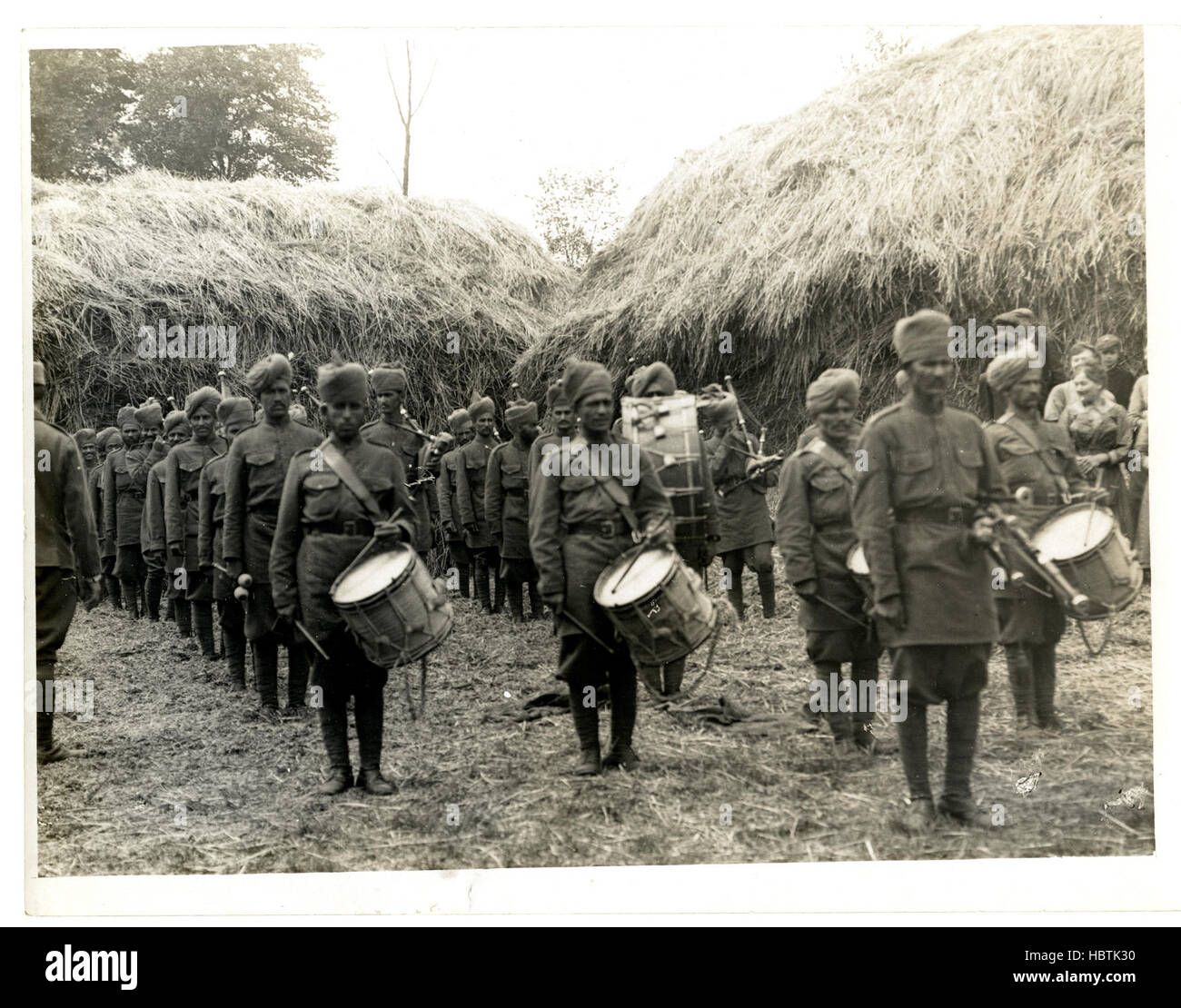 This page depicts an Indian infantry band performing on a French farm ...