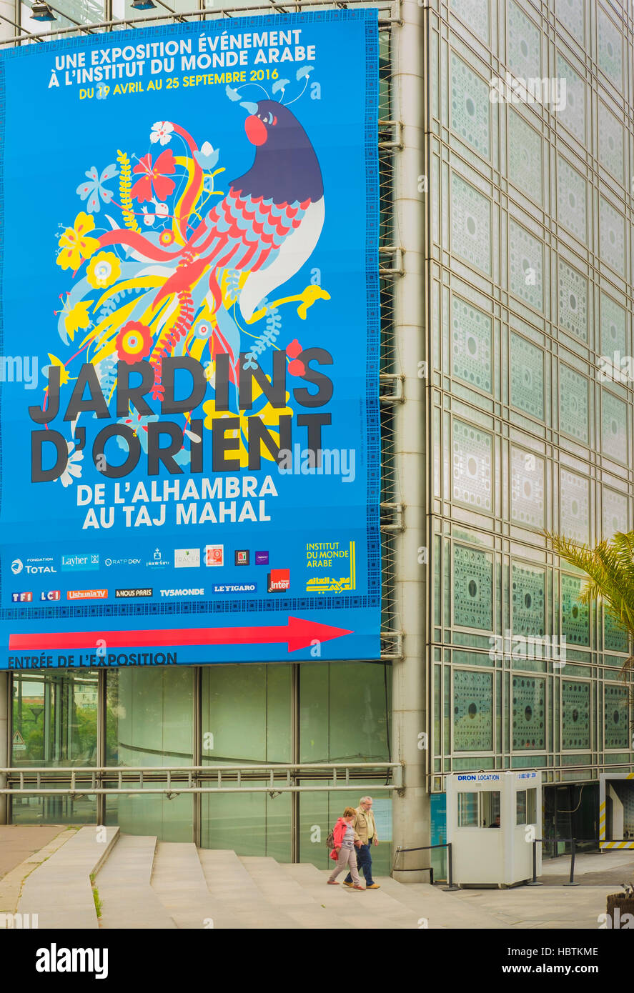 poster announcing an exhibition about oriental gardens on the facade of ...