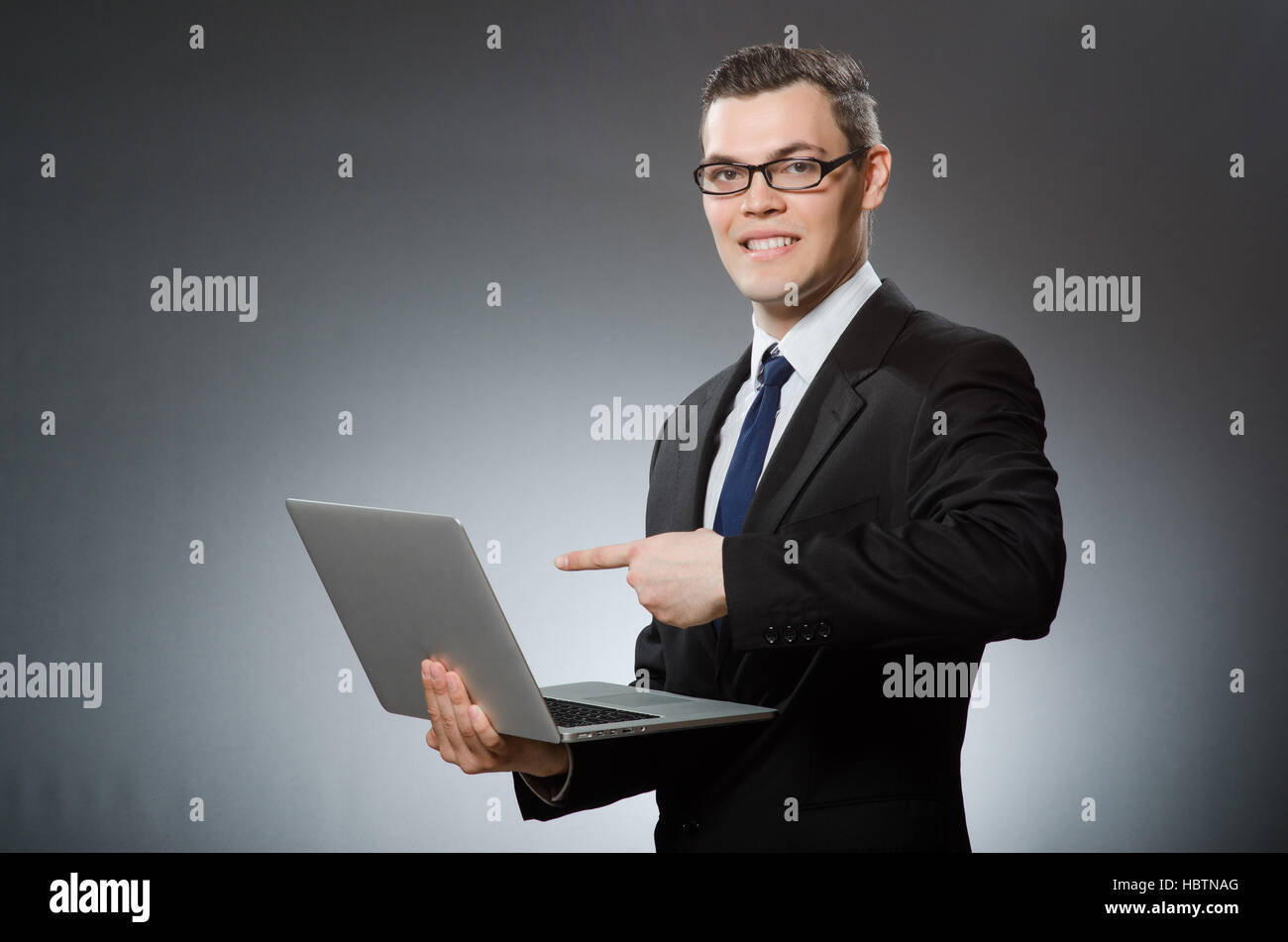 Man with laptop in business concept Stock Photo - Alamy