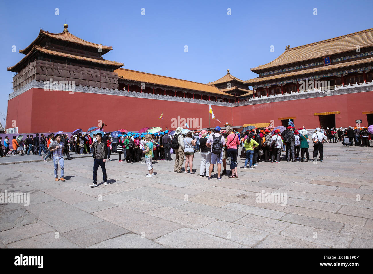 Tourists entering the gates of the forbidden city in Beijing, China ...