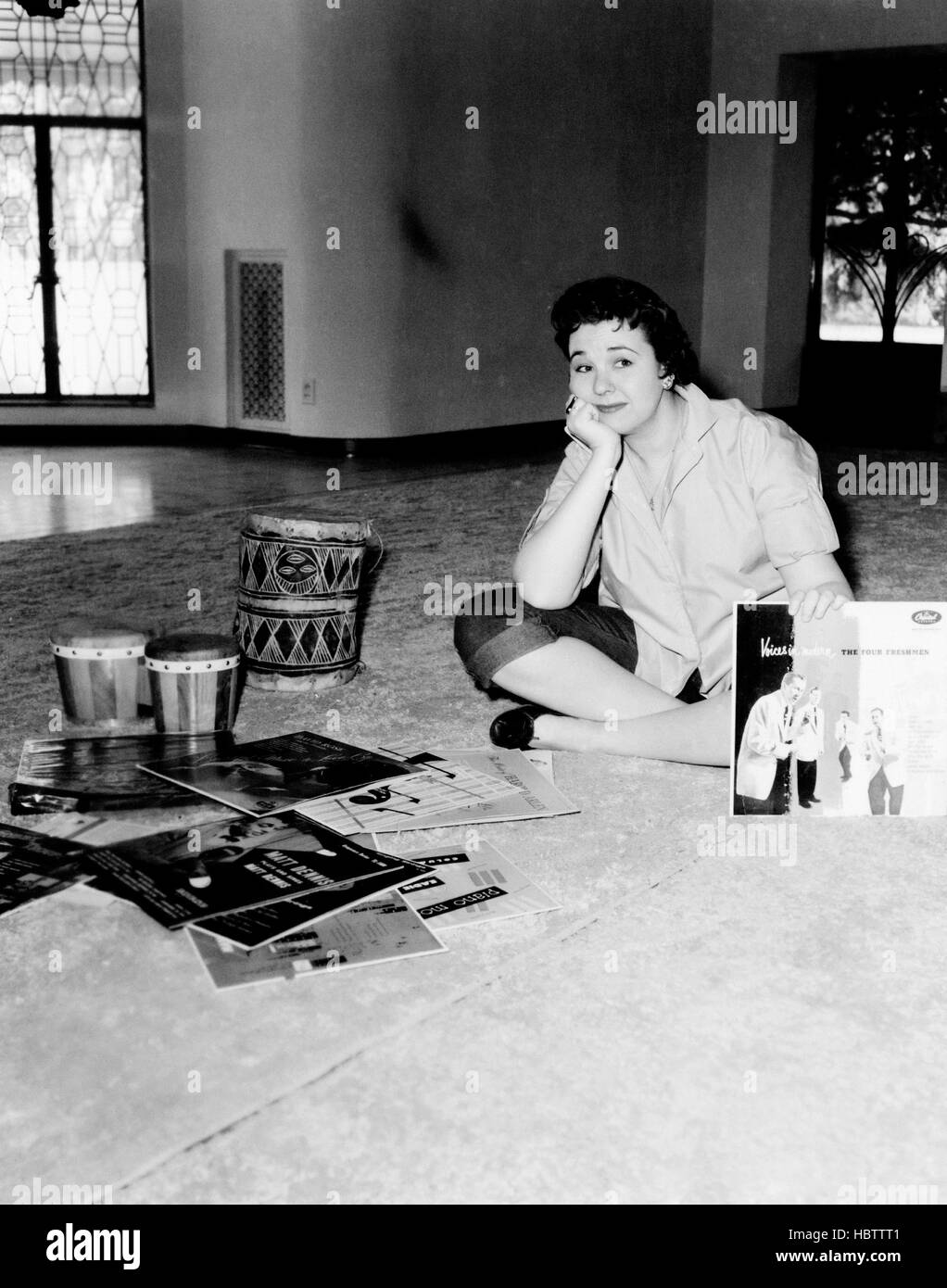 GIANT, Jane Withers, listening to album of her husband Kenneth Errair ...