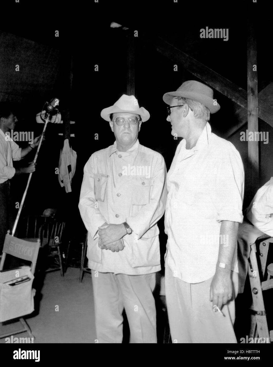 GIANT, from left, director George Stevens, visitor Michael Wilding, on ...
