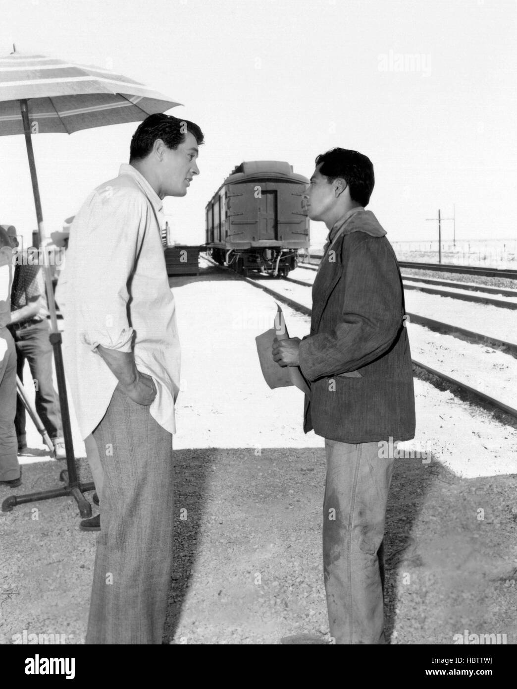 GIANT, from left, Rock Hudson, Victor Millan, on-set, 1956 Stock Photo ...