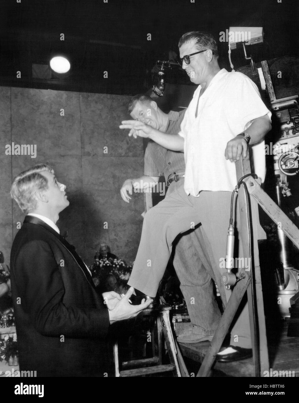 GIANT, from left, Rock Hudson, assistant cameraman Jim L. Mathews ...