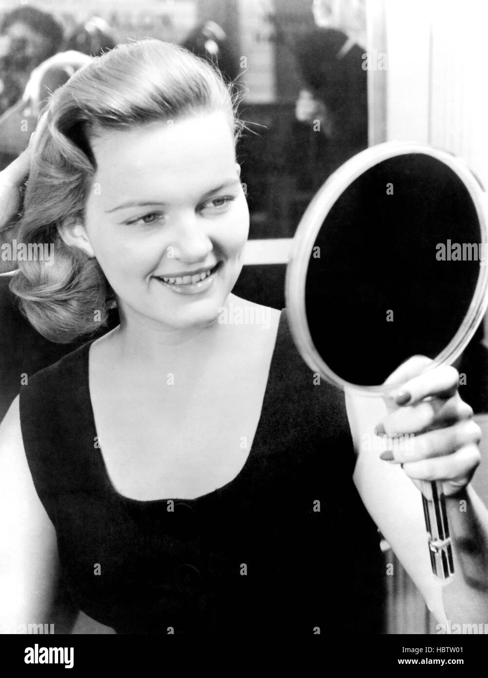 GIANT, Fran Bennett, checking her makeup in her dressing room, 1956 ...