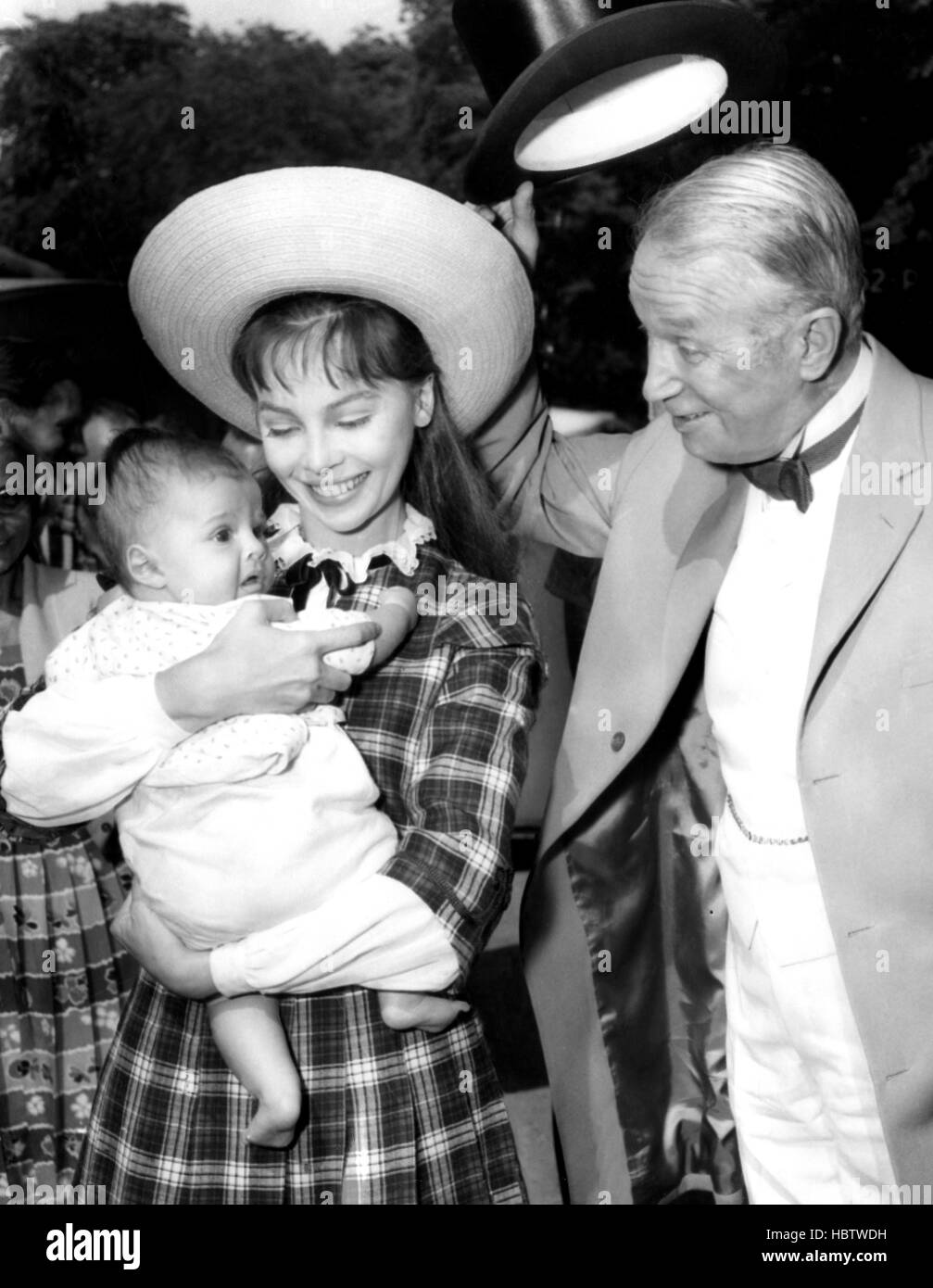 GIGI, Leslie Caron, son Christopher and Maurice Chevalier, on-set, 1957 ...