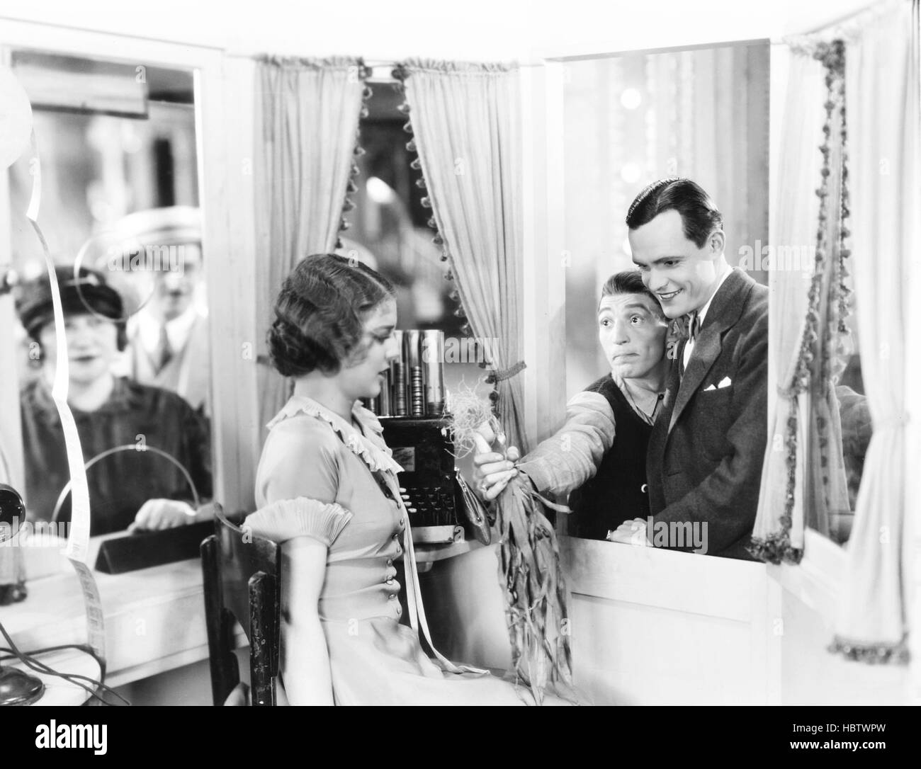 THE GIRL IN THE GLASS CAGE, from left: Loretta Young (seated), George E ...