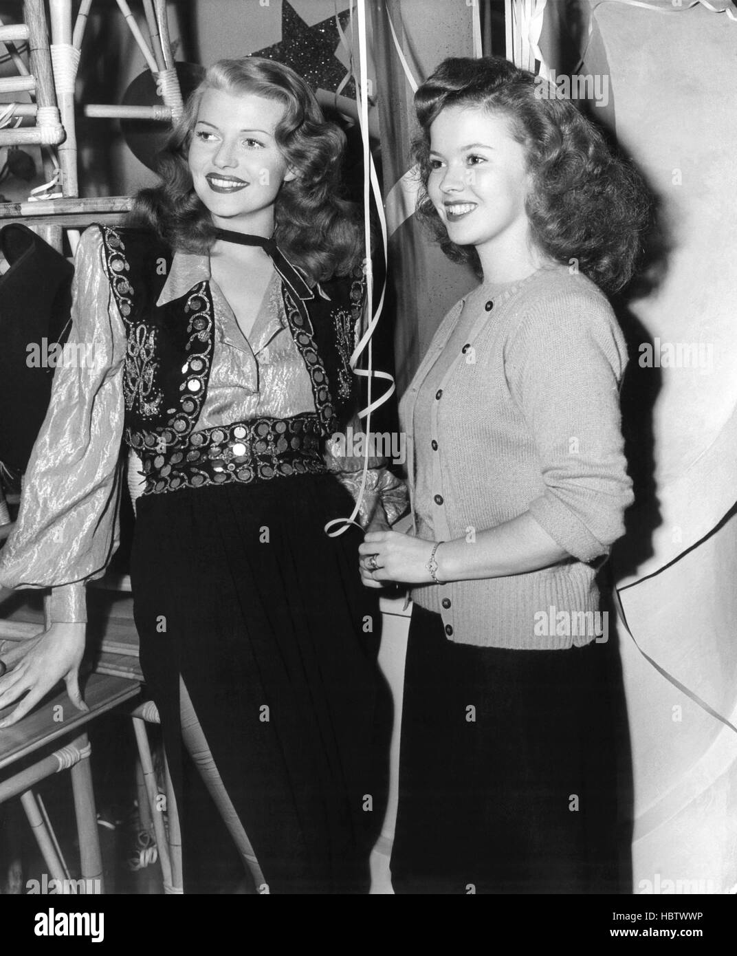 GILDA, from left: Rita Hayworth with visitor Shirley Temple on set ...