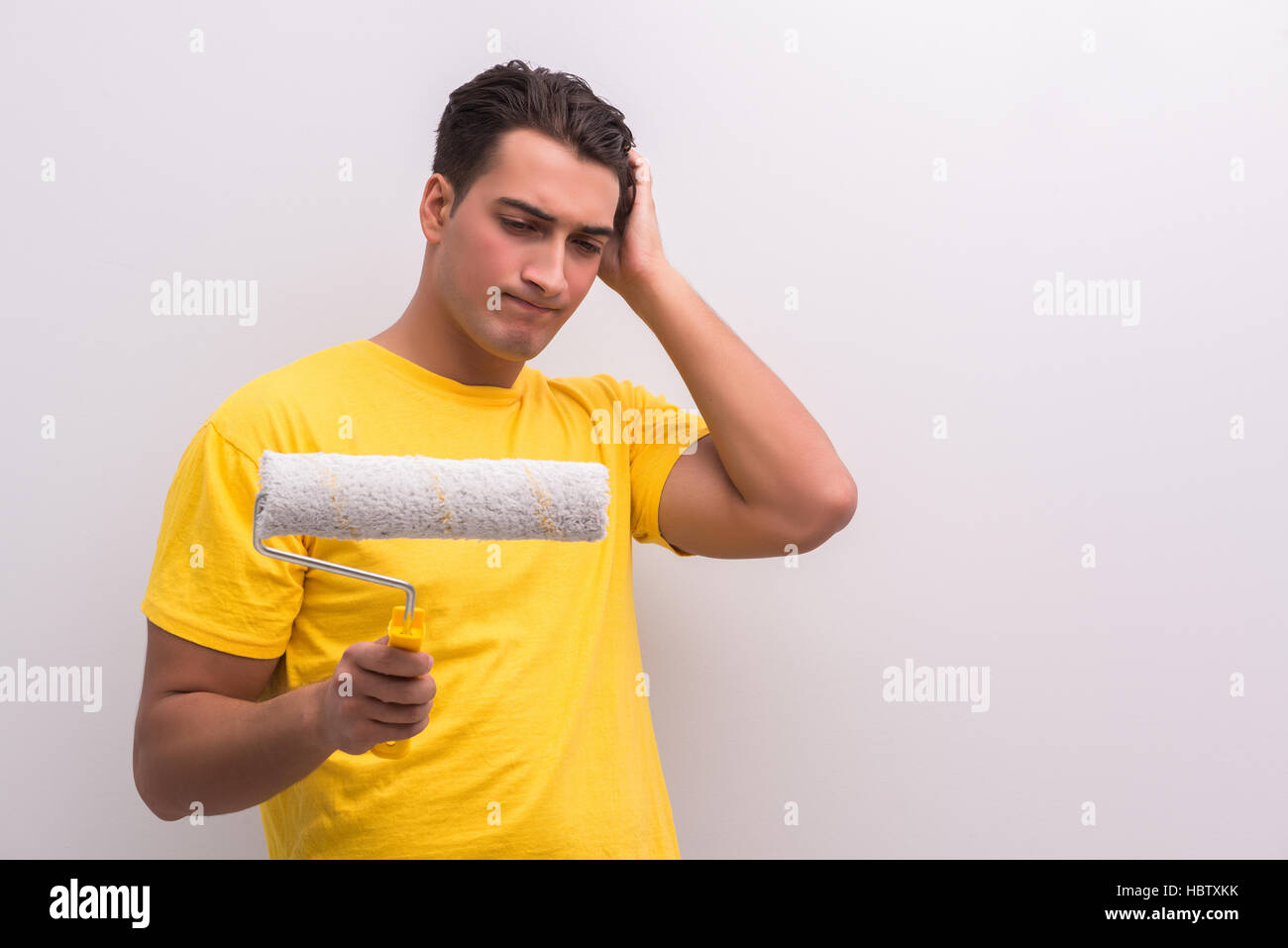Man painting house in DIY concept Stock Photo - Alamy