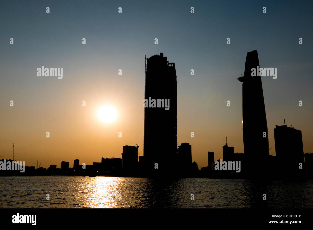Sunset in Saigon with Bitexco tower silhouette, Vietnam Stock Photo - Alamy