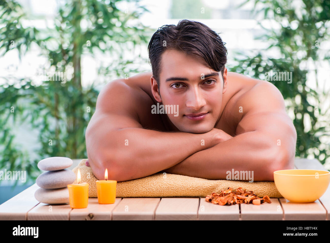 The handsome man during spa session Stock Photo - Alamy