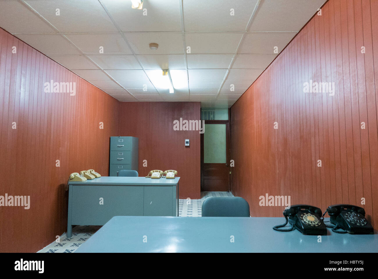 Old desk and chair in small office with vintage rotary phones, Saigon ...