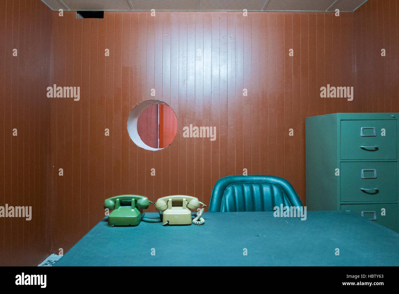 Old desk and chair in small office with vintage rotary phones, Saigon ...