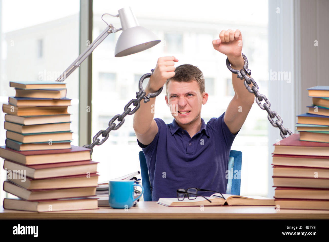 The young student forced to study tied Stock Photo - Alamy