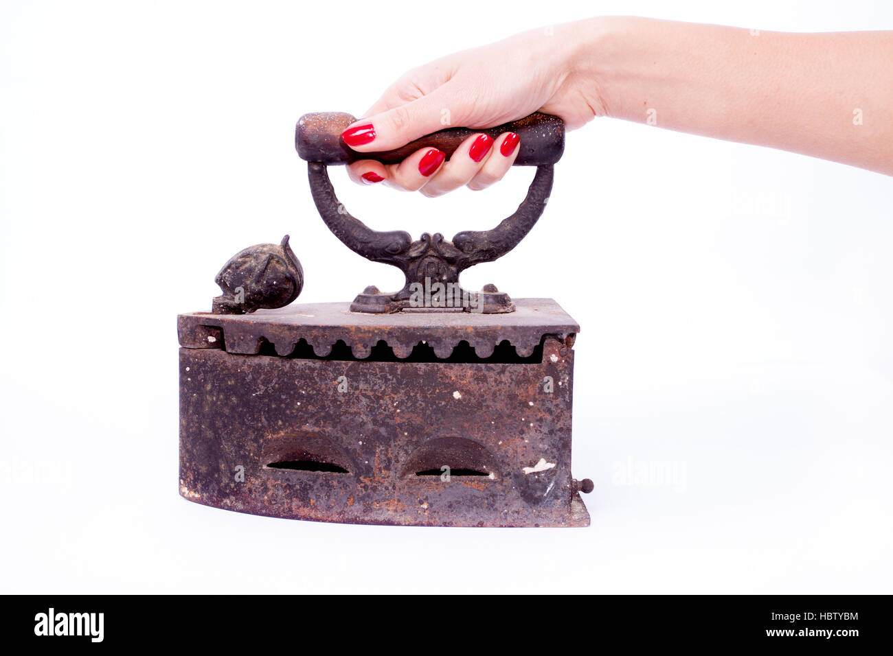 Woman hand holding vintage iron Stock Photo - Alamy