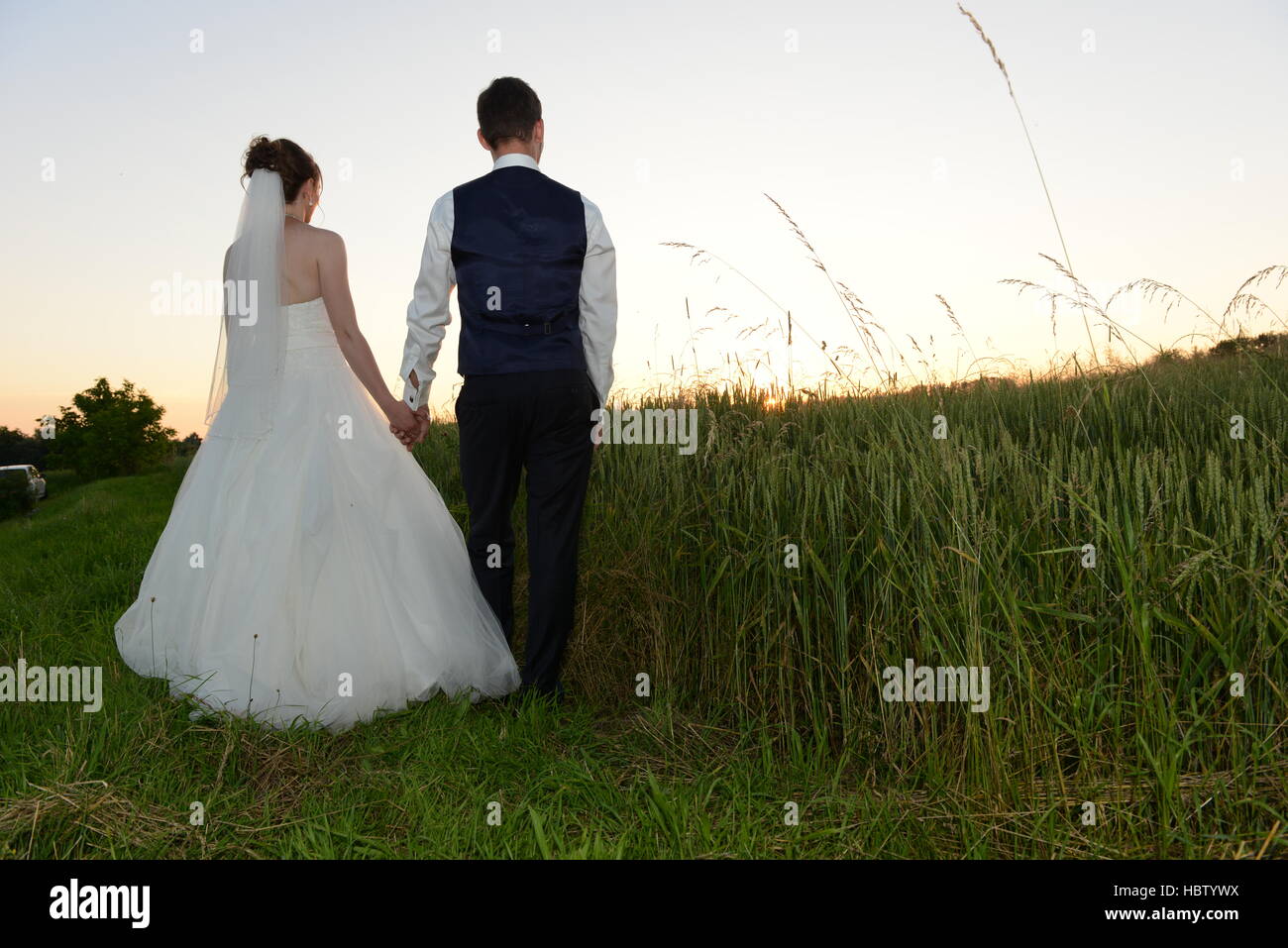 Love couple in sunset field hi-res stock photography and images - Alamy