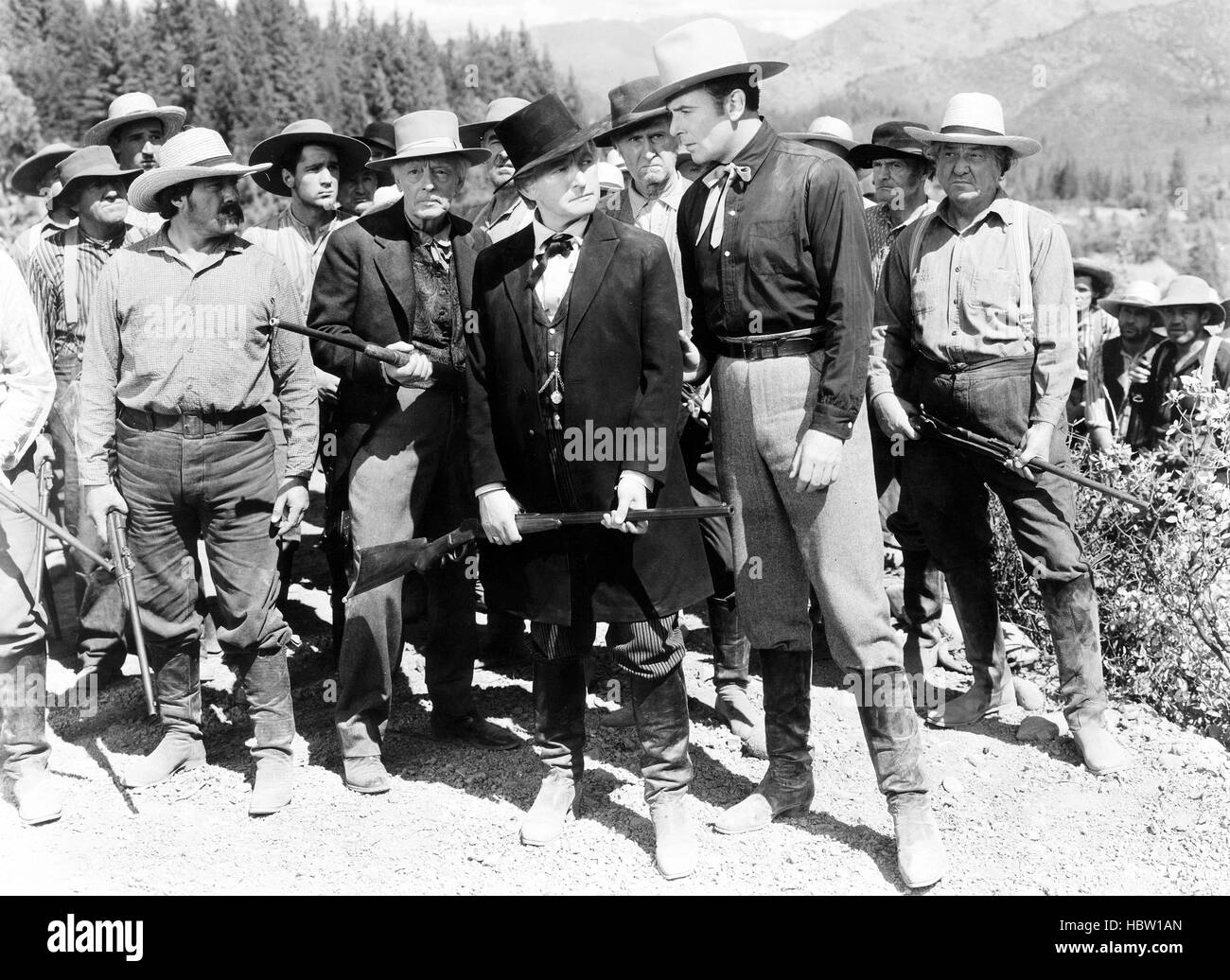 GOLD IS WHERE YOU FIND IT, from left: Harry Davenport (rifle facing ...